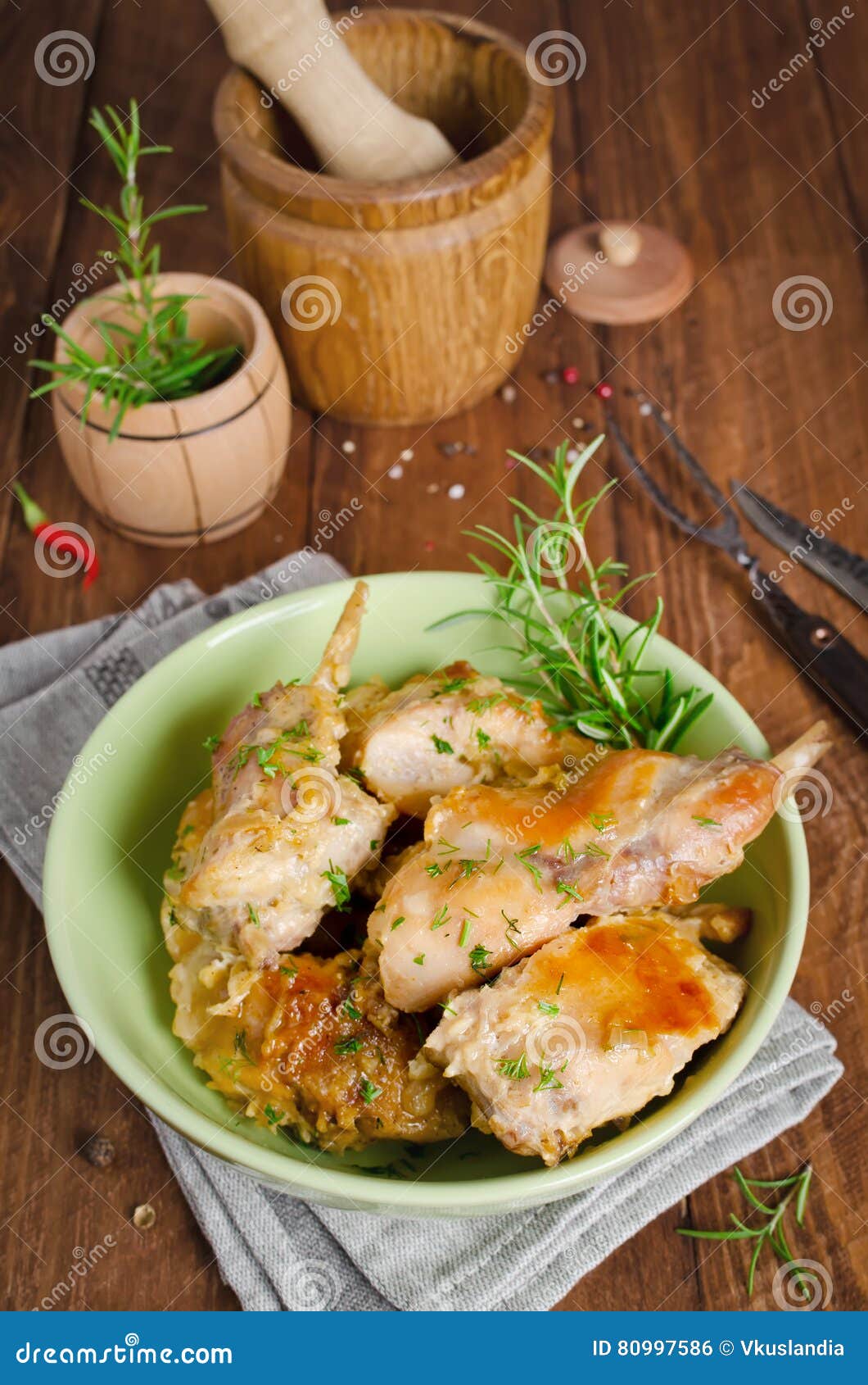 Oven Baked Rabbit Legs with Potatoes and Rosemary Stock Photo - Image ...