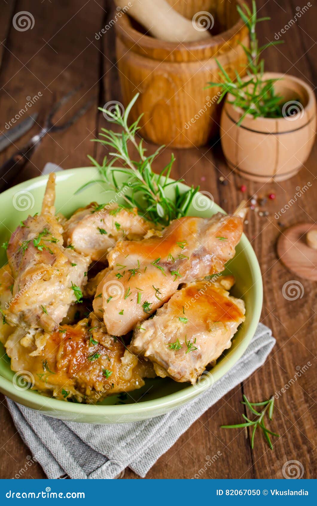 Oven Baked Rabbit Legs with Potatoes and Rosemary Stock Photo - Image ...