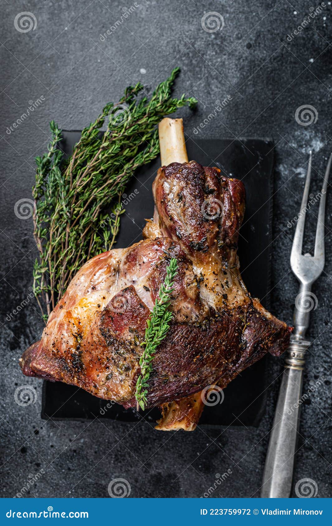 Oven Roasted Lamb Mutton Whole Leg with Thyme. Black Background Stock ...