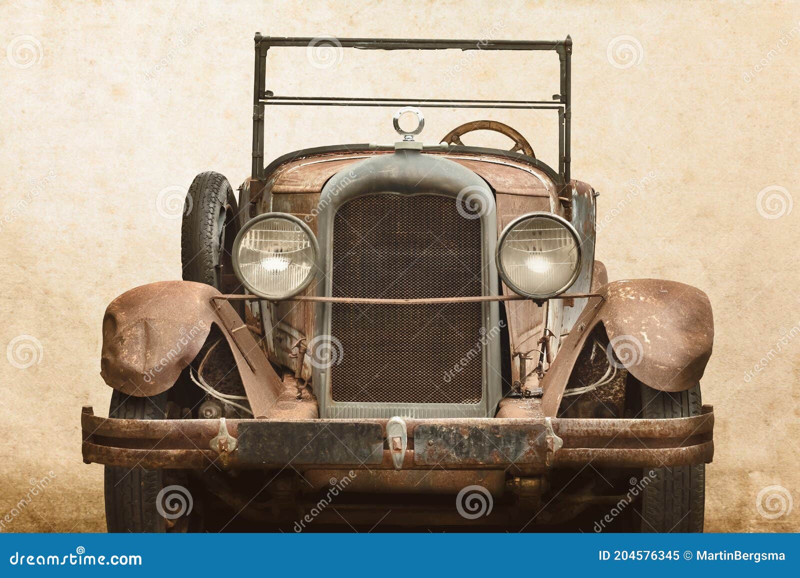 Over a Century Old Rusted and Broken Classic Car in Front of an Old ...