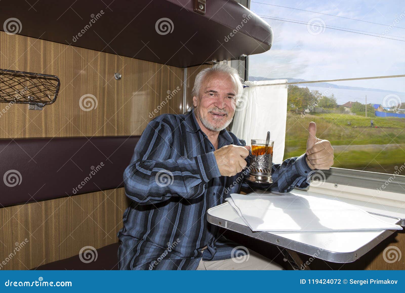 Over a Cup of Tea on the Train Stock Photo - Image of lake, coffee ...