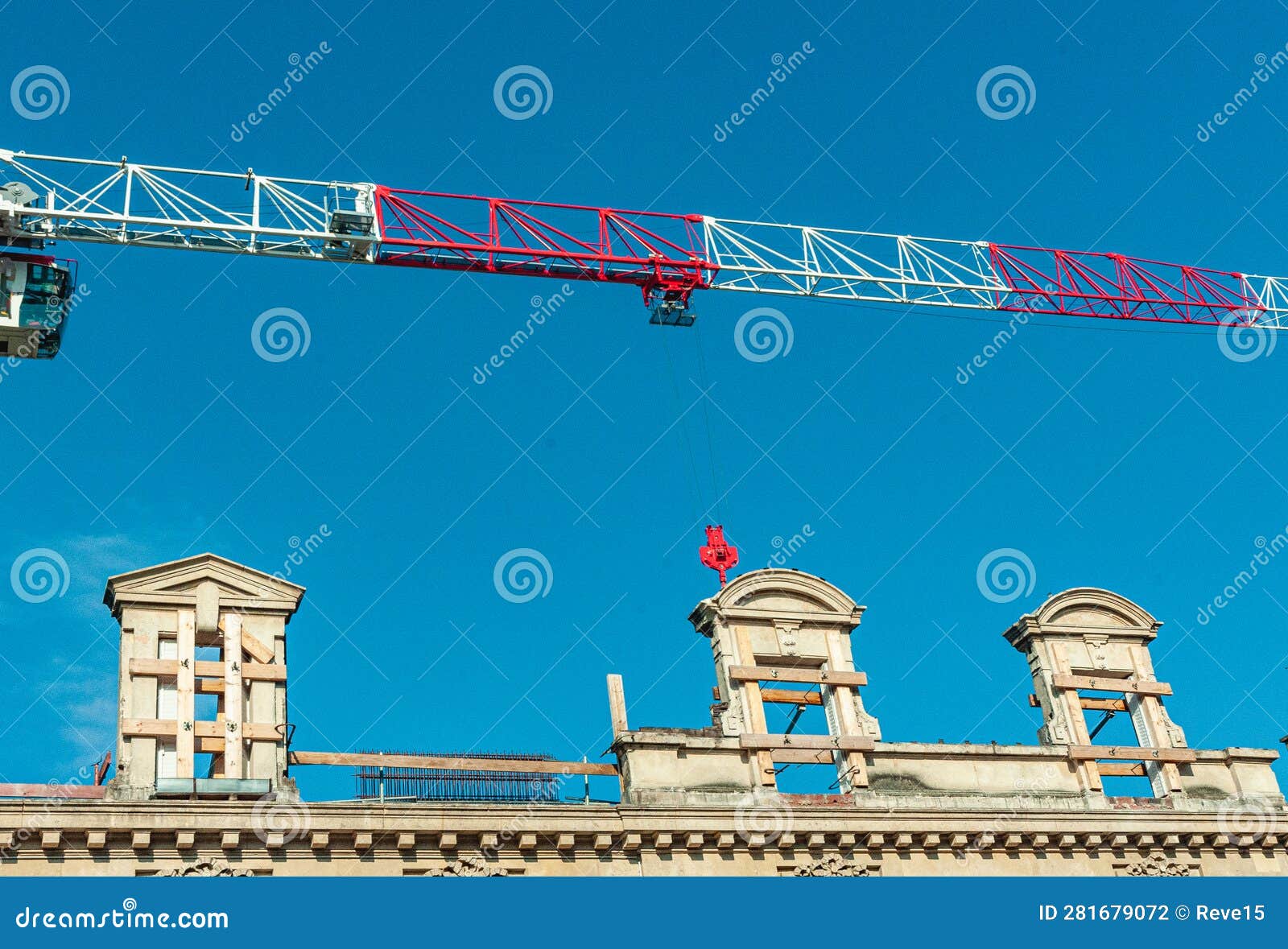 Over Head Crane, Rail and Hoist, Behind Three Historic, Stone Window ...