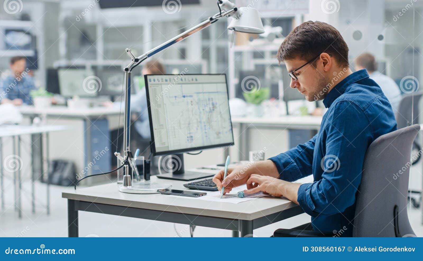Over the Shoulder Shot of Engineer Working with CAD Software on Desktop ...