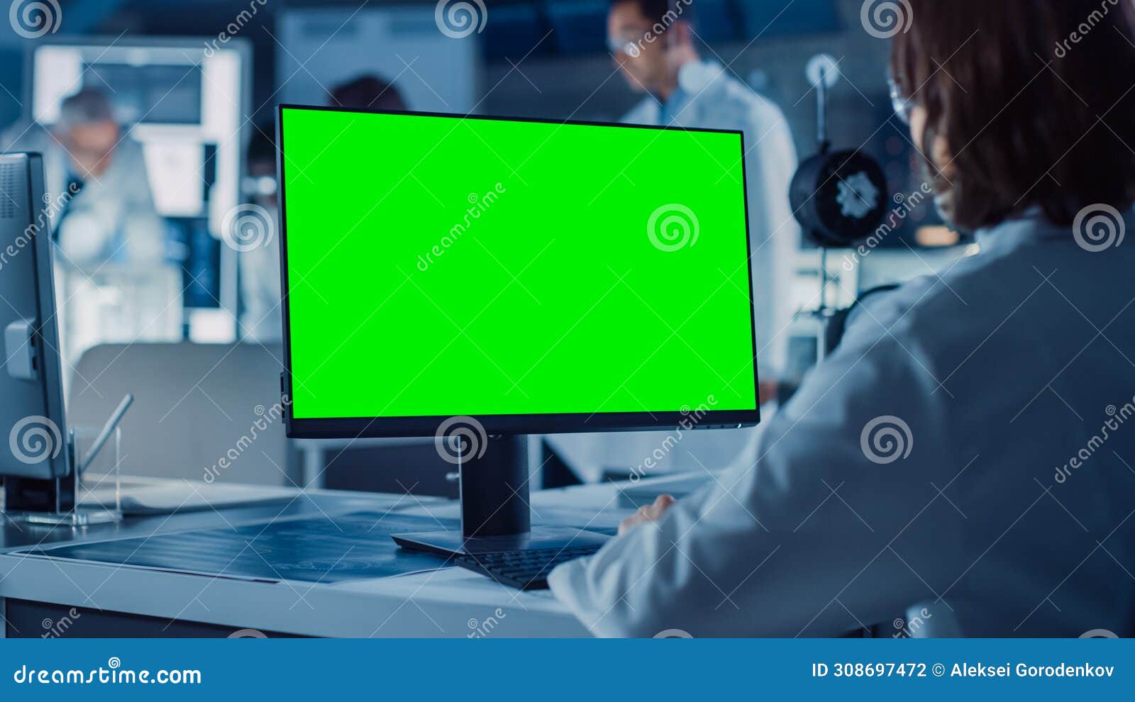 Over the Shoulder Shot: Female it Scientist Uses Green Mock-up Screen ...