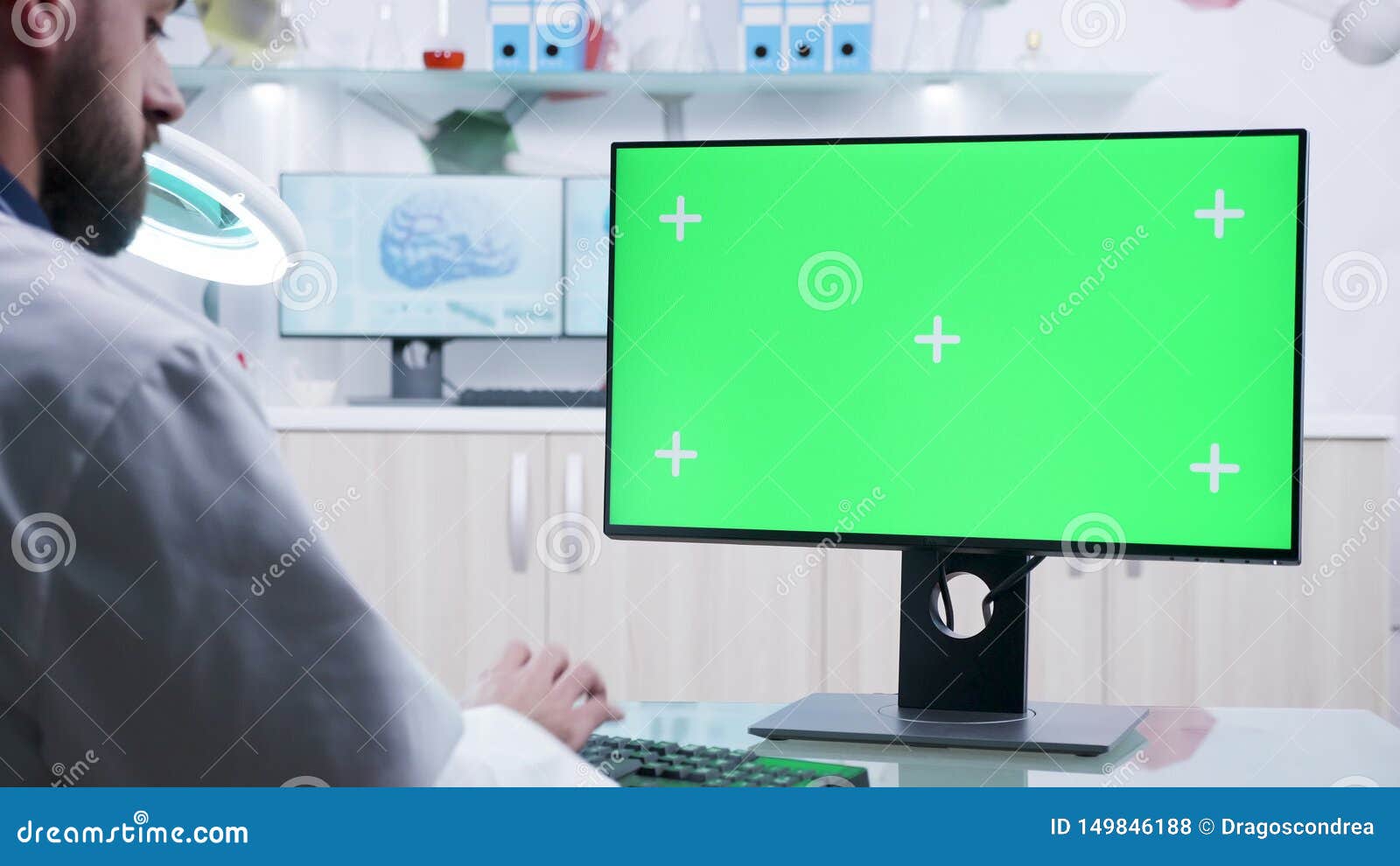 Over the Shoulder Shot of Scientist Working on Green Screen Computer ...