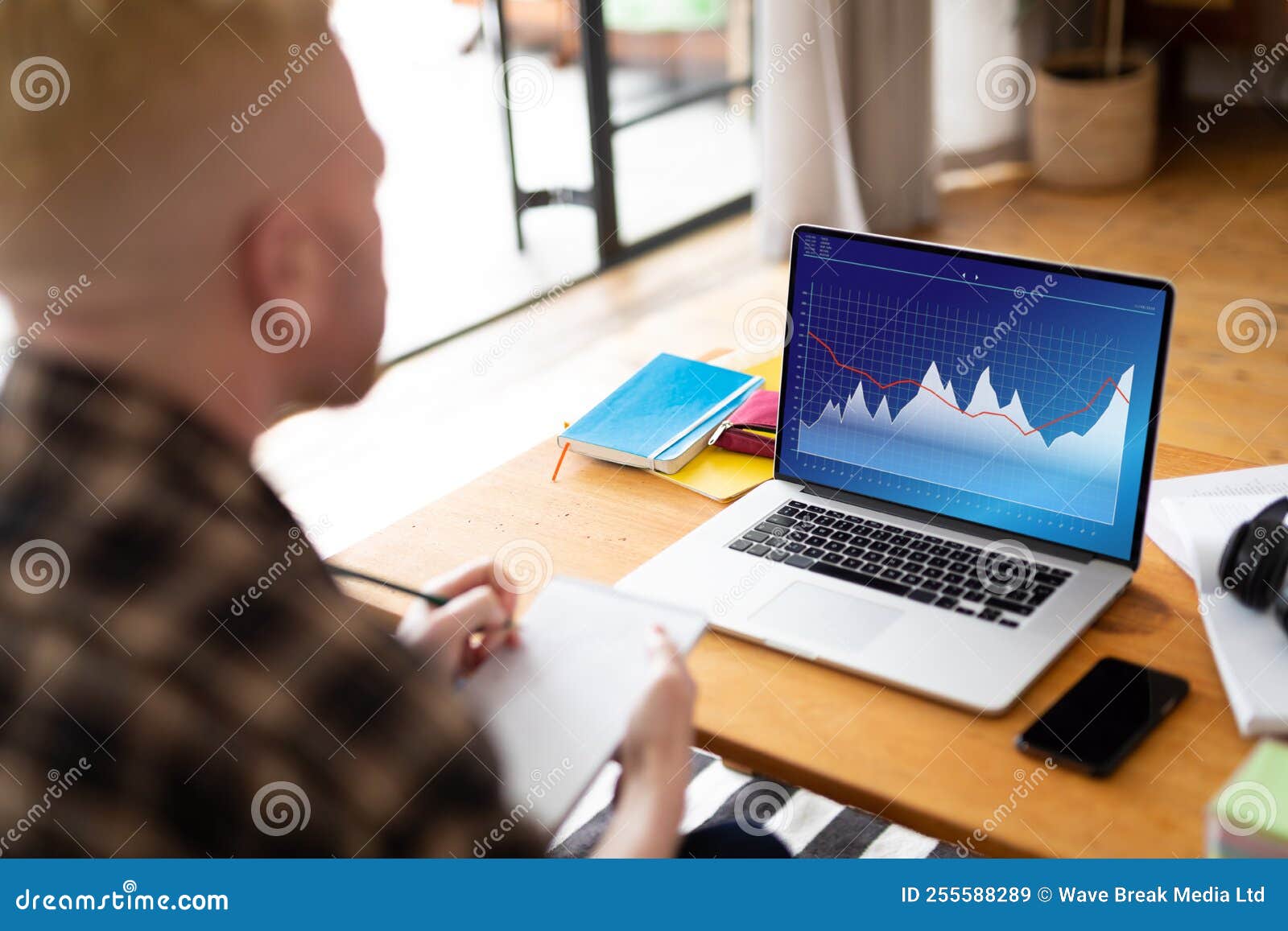 Over Shoulder View of Caucasian Businessman Writing Notes and Using ...