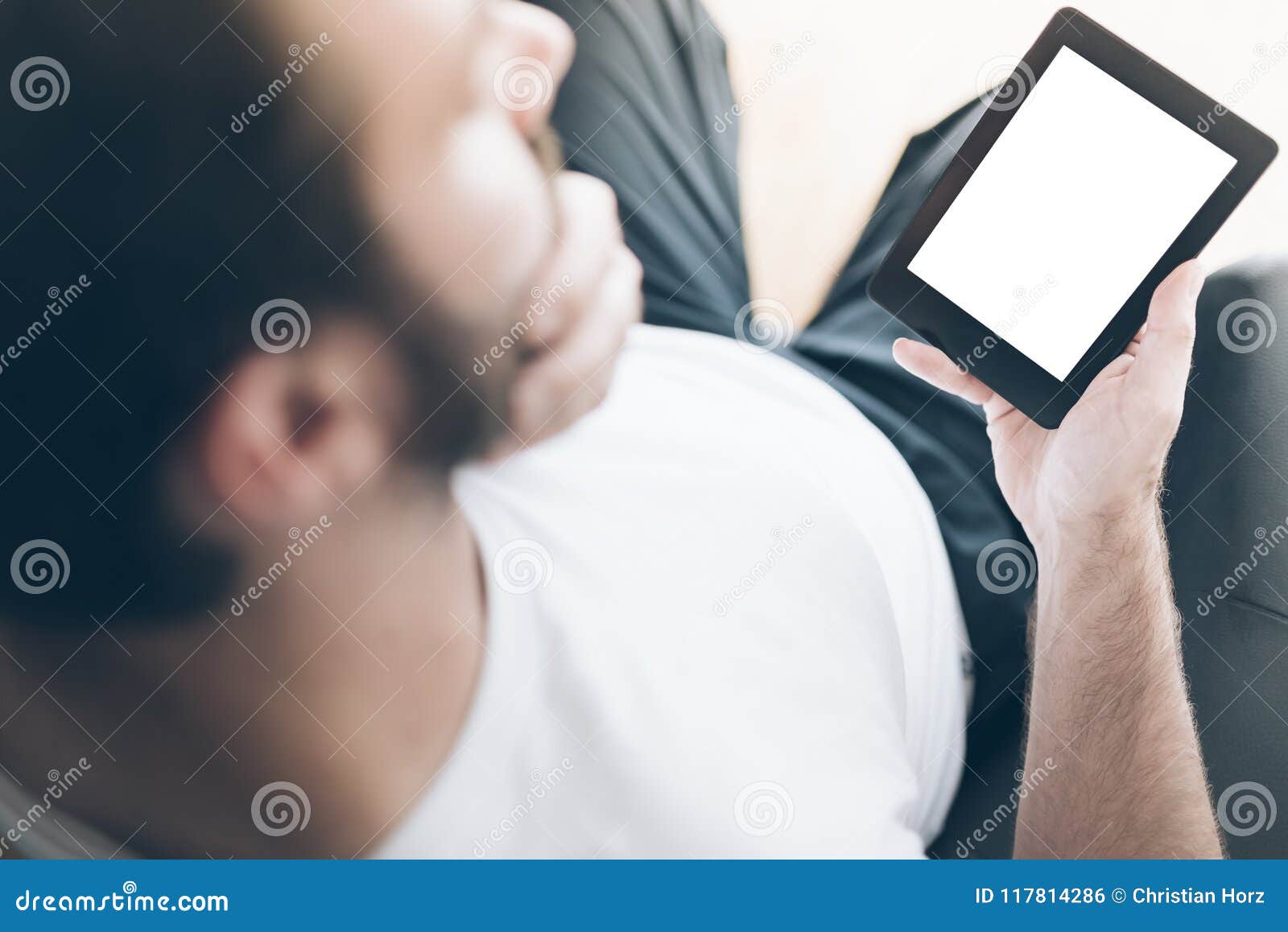 Over the Shoulder View of Man Sitting on Armchair Using E-book Reader ...