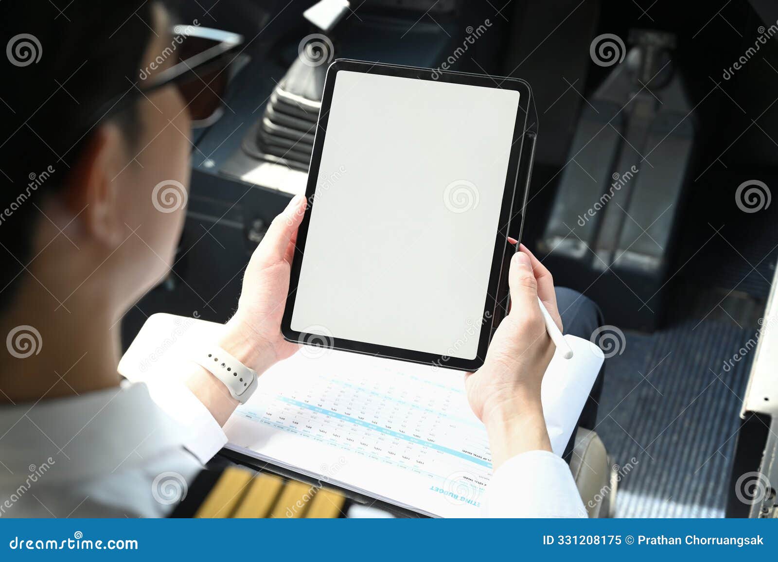 Over Shoulder View of Pilot Wearing Sunglasses Using Digital Tablet in ...