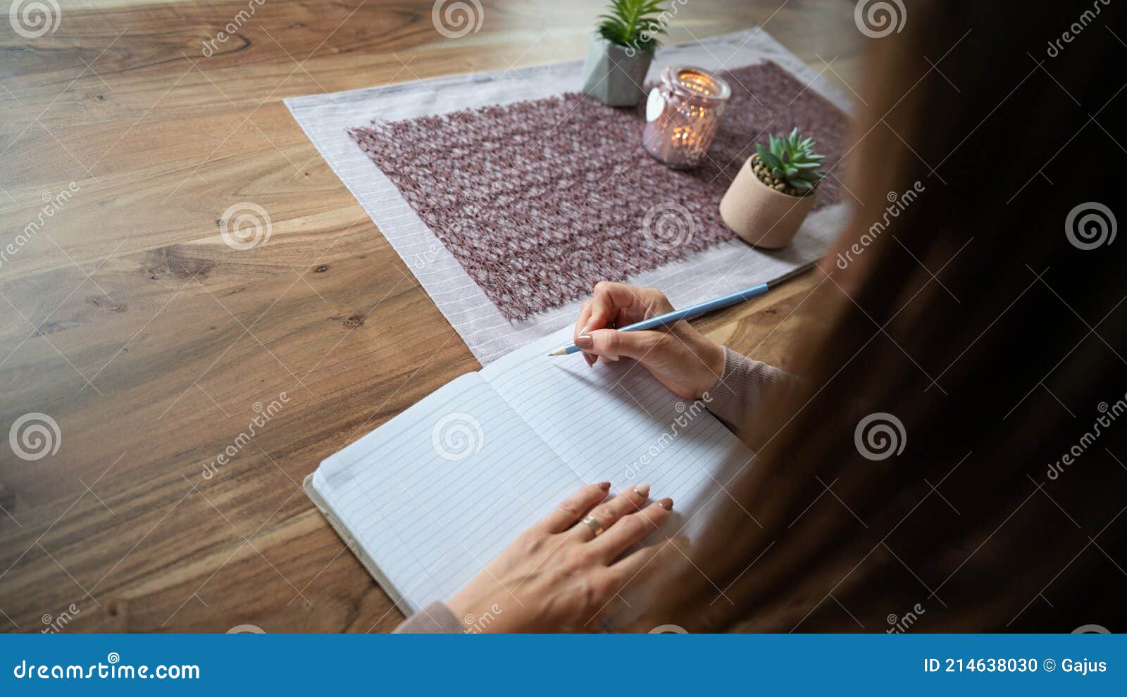 Over the Shoulder View of a Woman, Student, Writing in Notebook Stock ...
