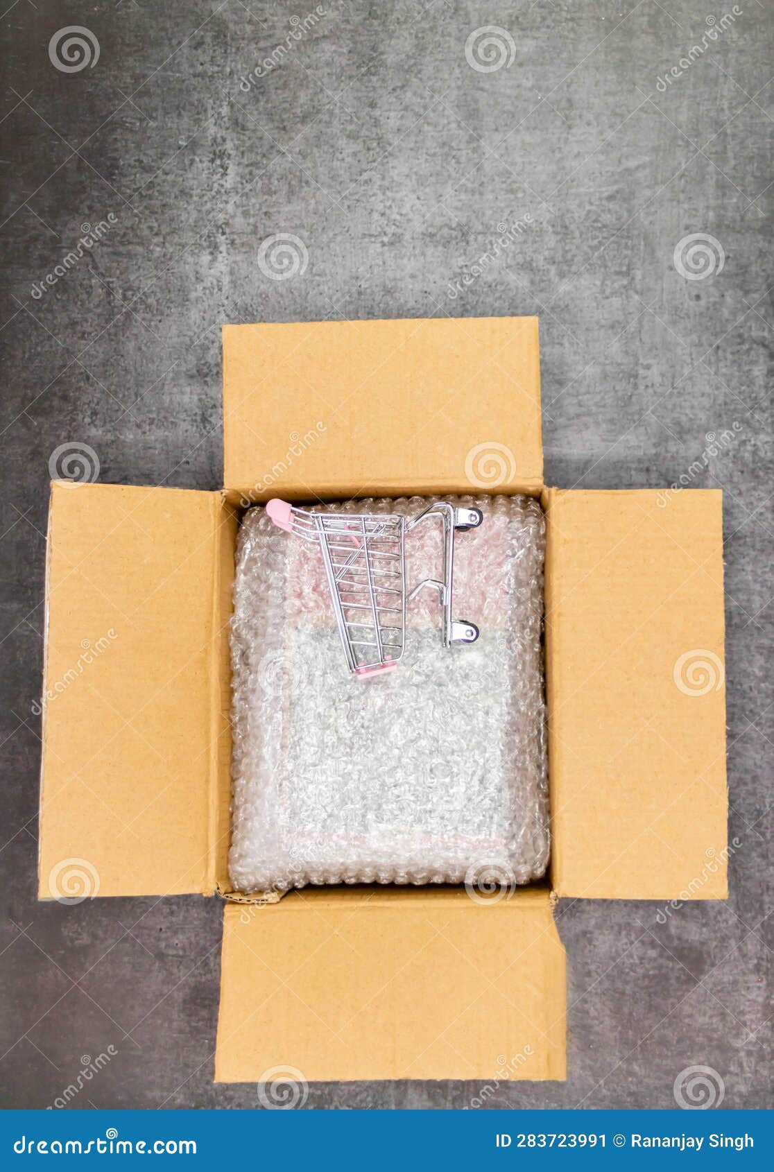Over the Top Shot of Parcel Covered with Bubble Wrap in Box and Cart Put on it Stock Image ...
