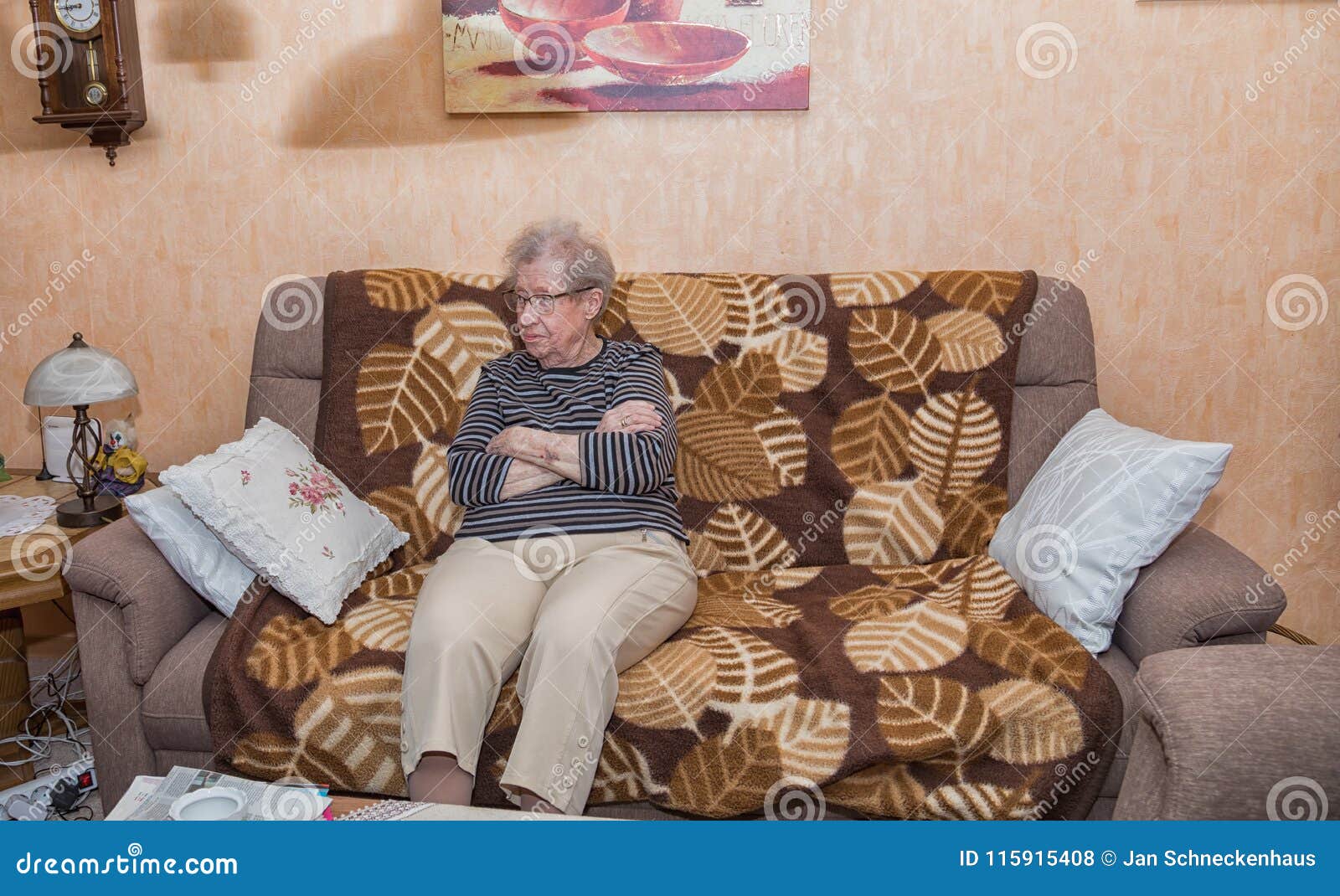 61 Year Old Grandmother With An Amused Face Listens To An Entertaining