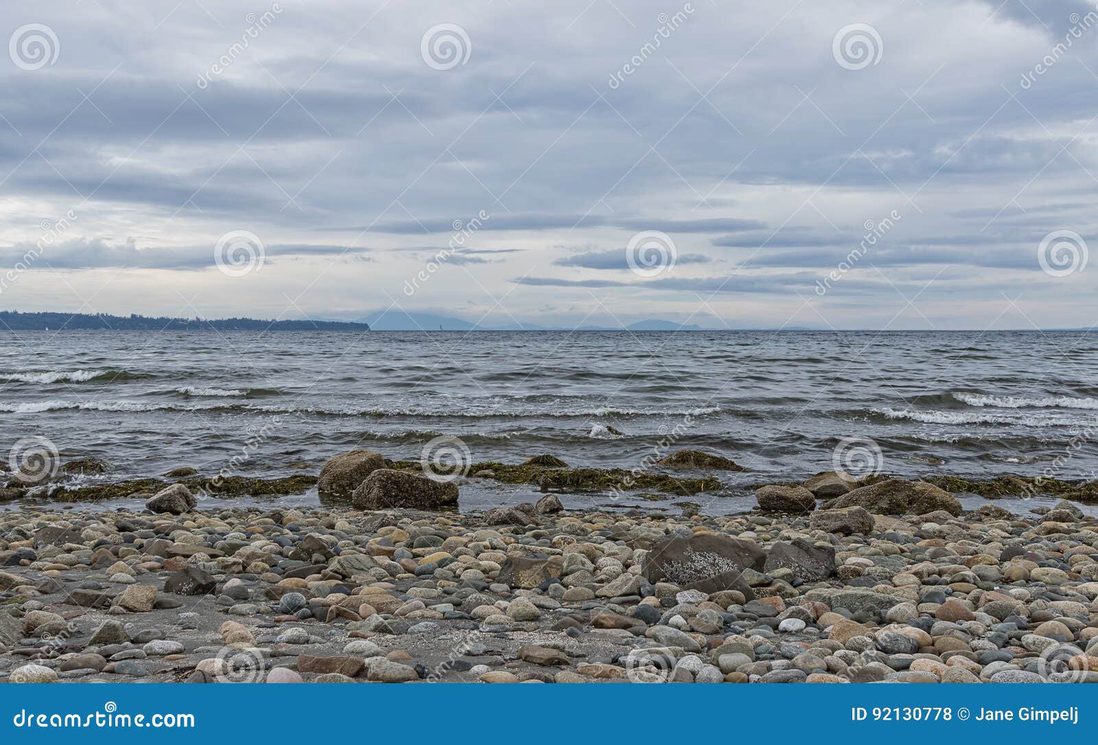 Overcast Skies Over the Pacific Ocean and Rocky Beach Stock Photo ...