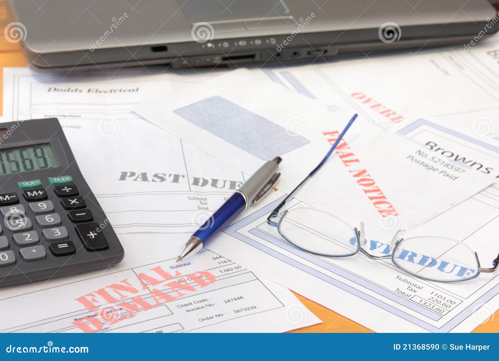 Overdue Bills with Calculator and Laptop Stock Photo - Image of ...