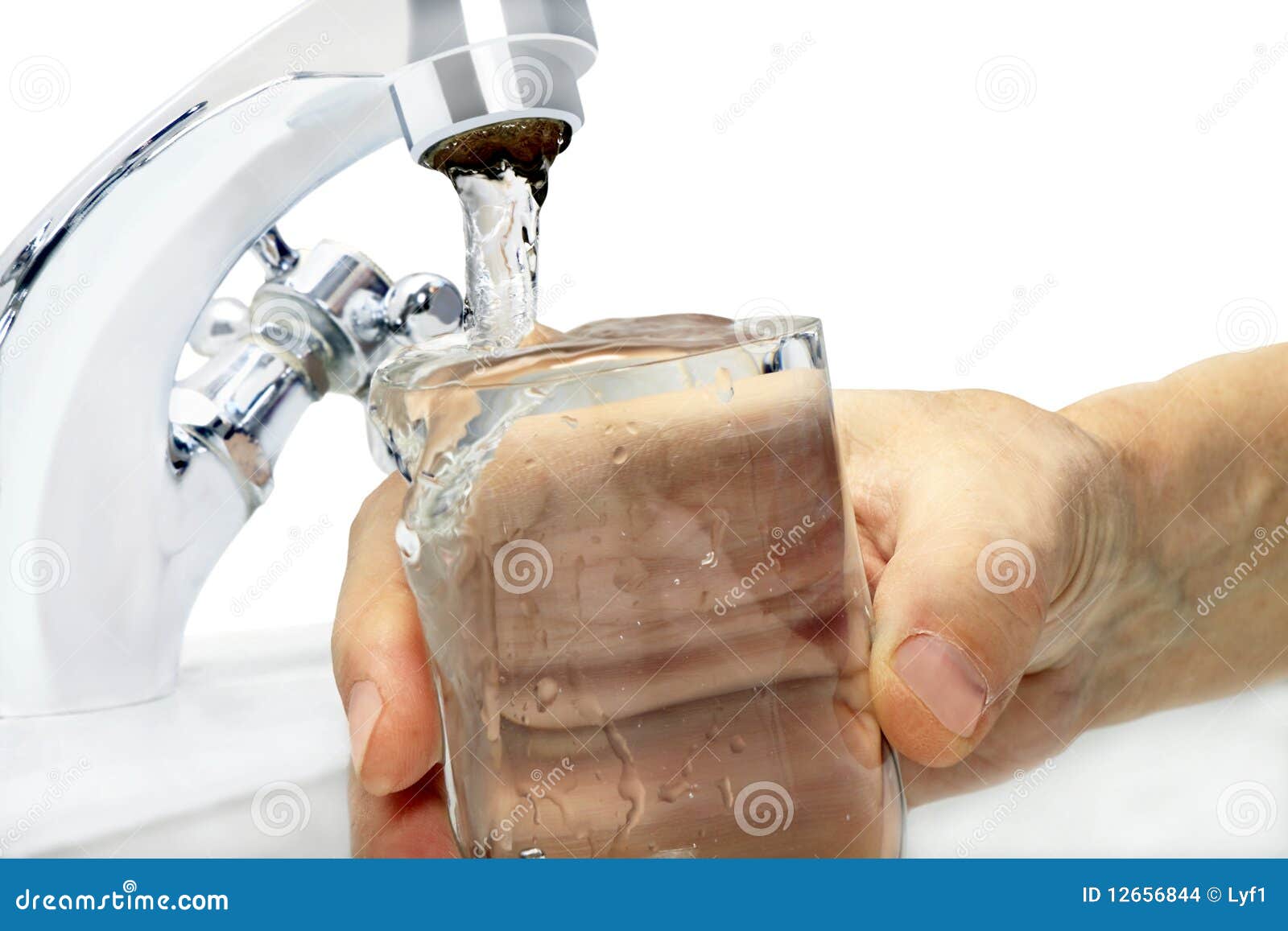 Overfilling glass of water stock photo. Image of thumb - 12656844
