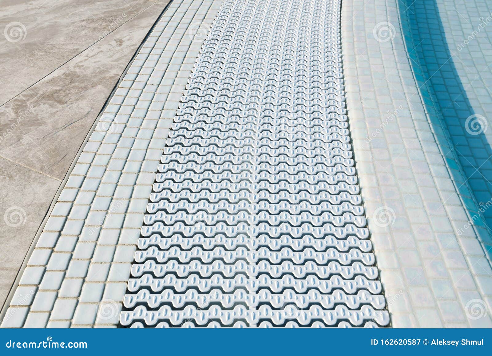 Overflow Grilles for Swimming Pools. Tap Water at the Edge of the Bowl ...