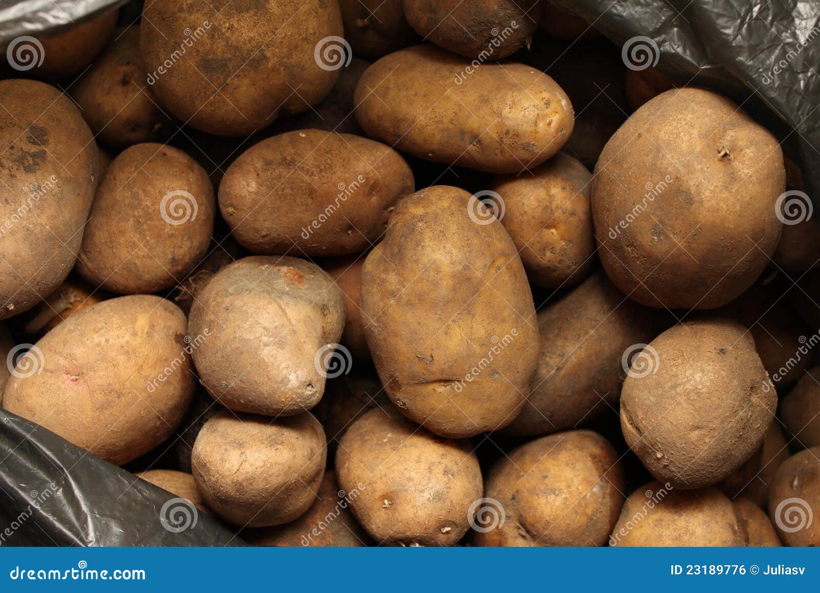 Overflowing bag of potatos stock photo. Image of horizontal - 23189776