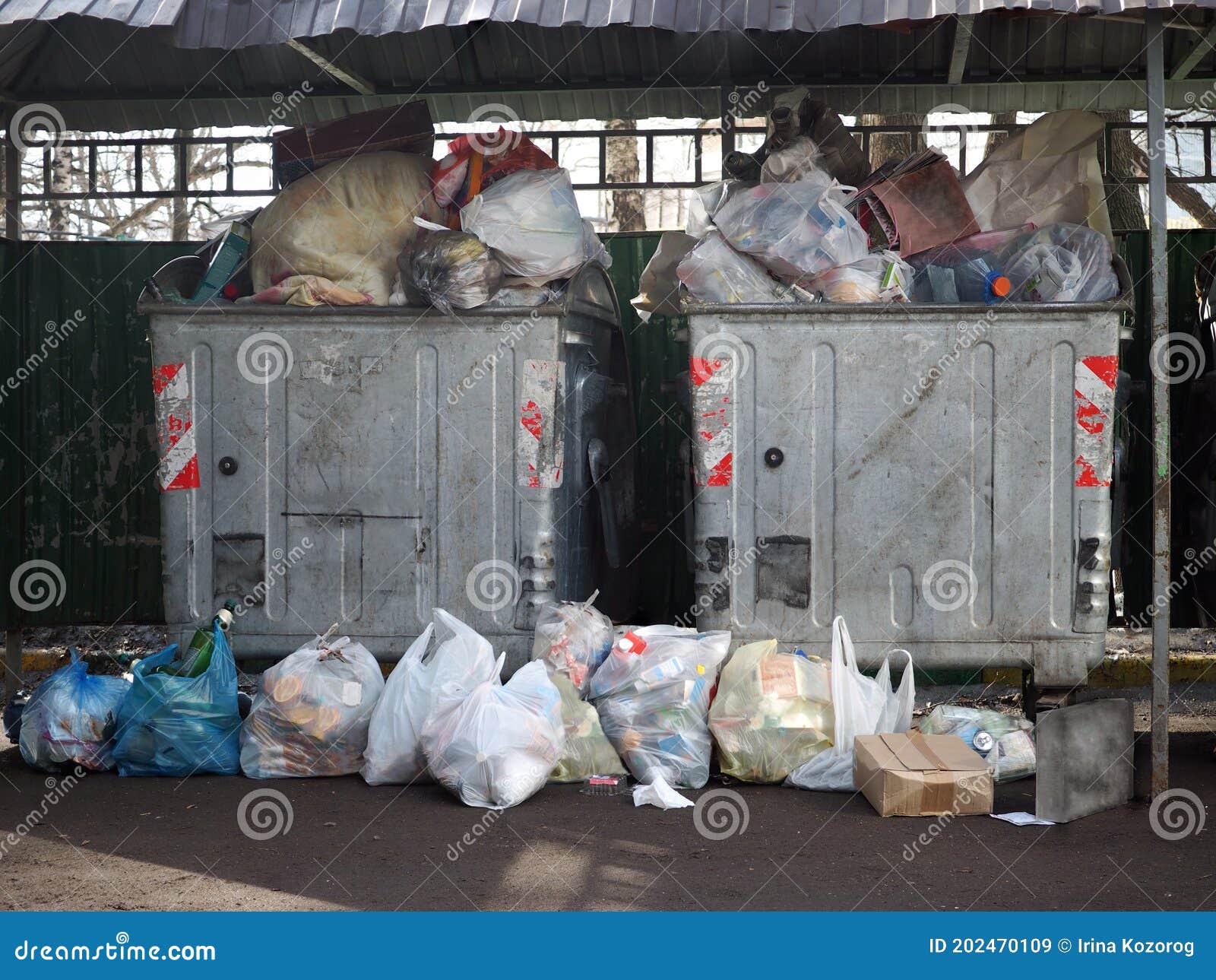 Overflowing garbage cans stock image. Image of mess - 202470109