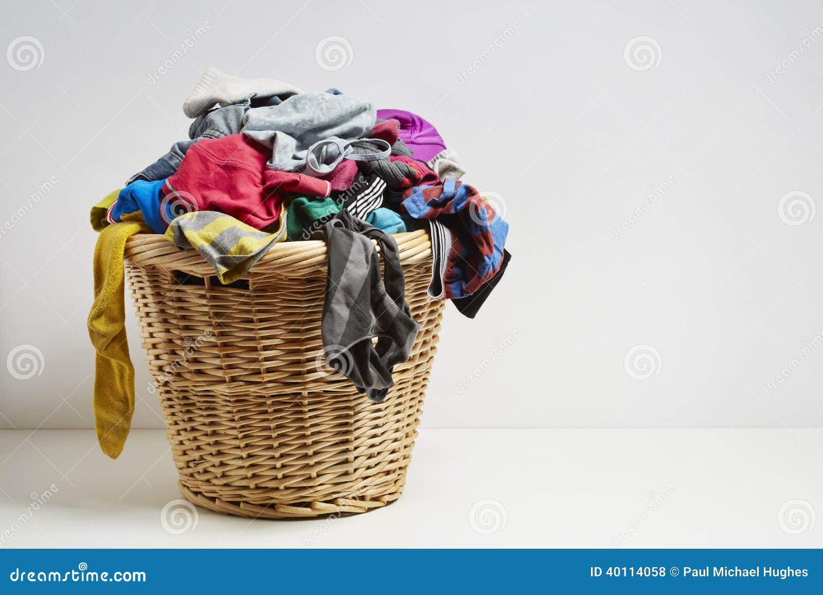 Overflowing laundry basket stock photo. Image of hectic - 40114058