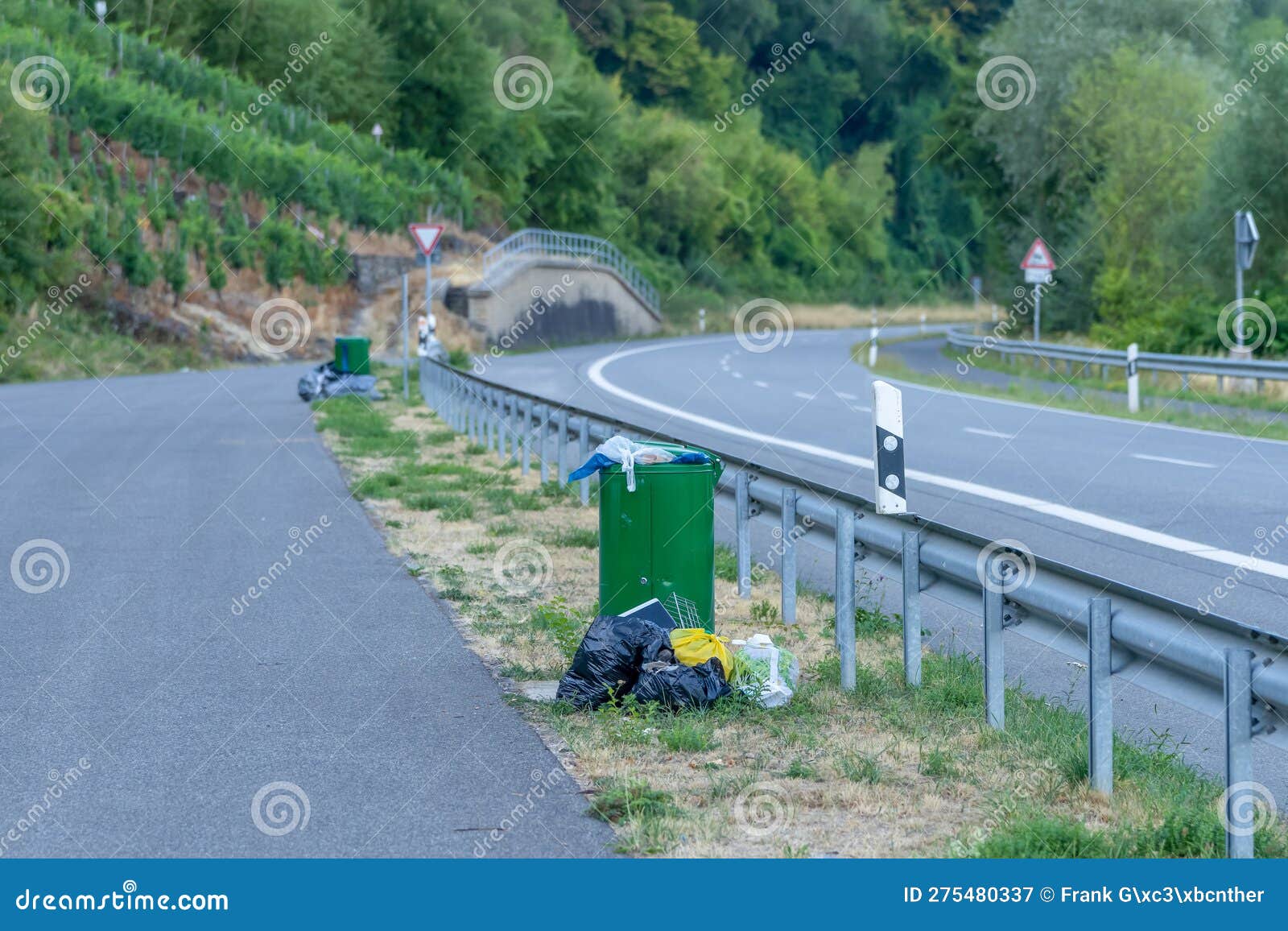 An Overflowing Rubbish Bin at the Roadside Shows Problems with Disposal ...