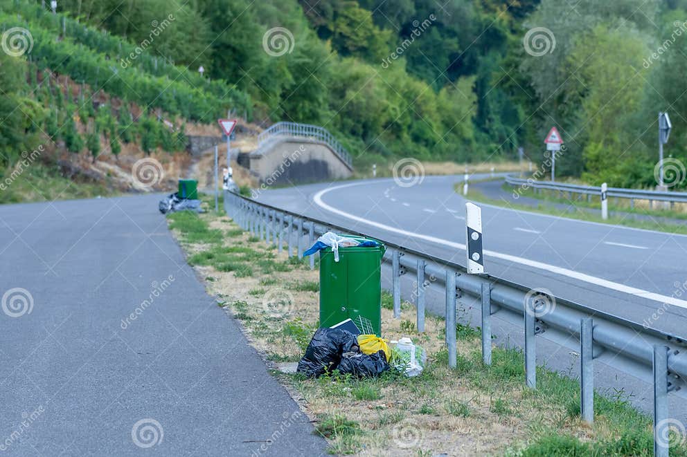 An Overflowing Rubbish Bin at the Roadside Shows Problems with Disposal ...