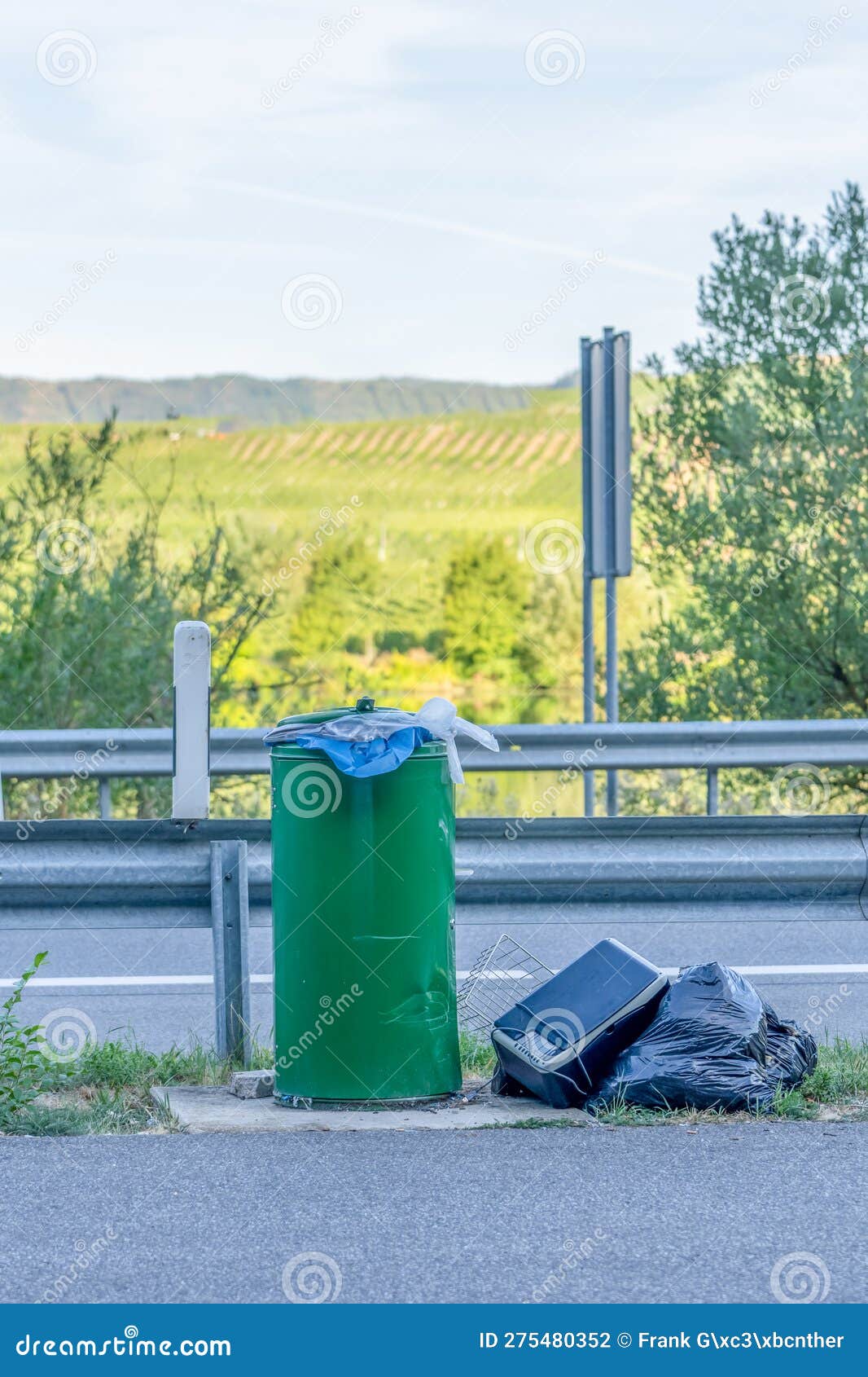 An Overflowing Rubbish Bin at the Roadside Shows Problems with Disposal ...
