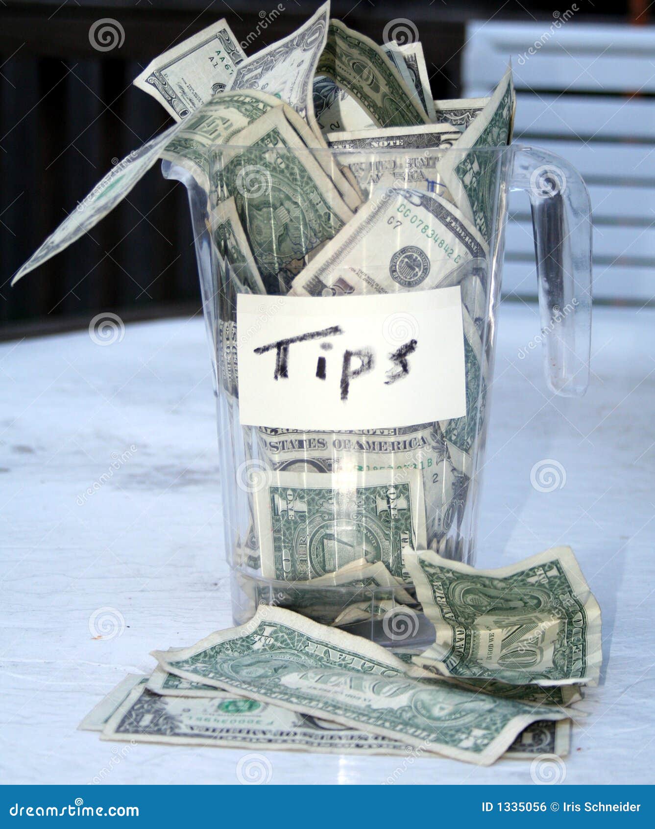 Overflowing tip cup stock photo. Image of cash, finance - 1335056