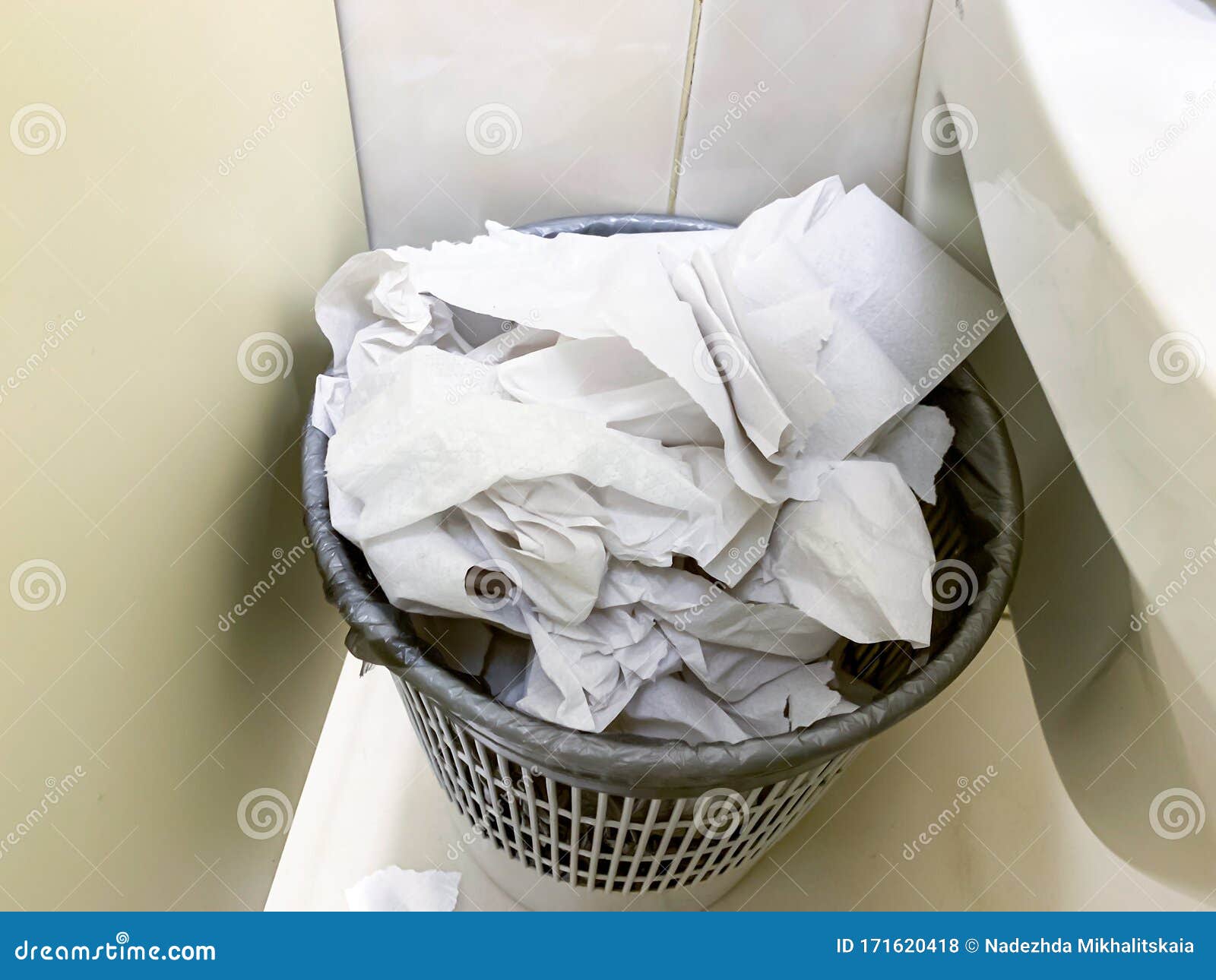 Overflowing Trash Can, Dustbin Full of Used Toilet Paper Near the ... Overflowing Trash Can, Dustbin Full of Used Toilet Paper Near the ...