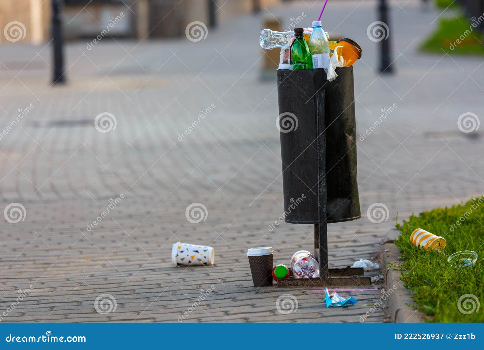 Overflowing Trash Can On Stone Pavement Background.The Plastic ...