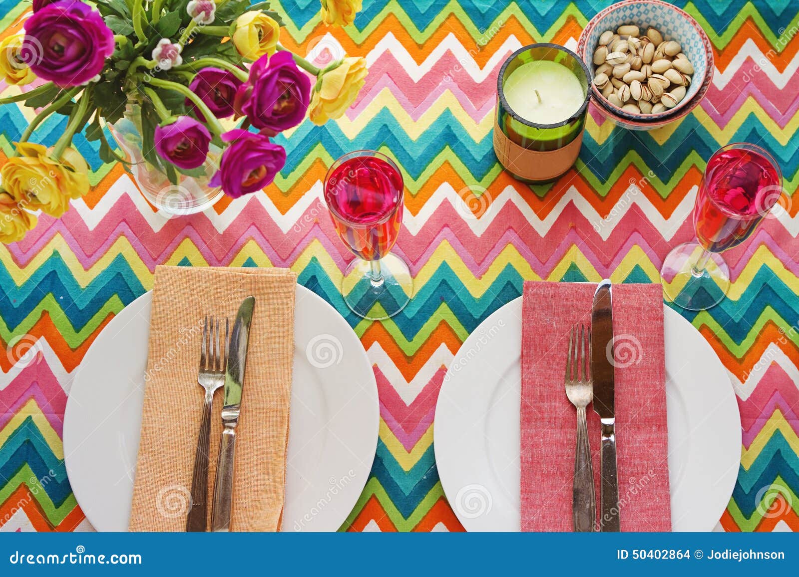 Overhead Bright Colorful Table Setting with Chevron Tablecoth Stock ...