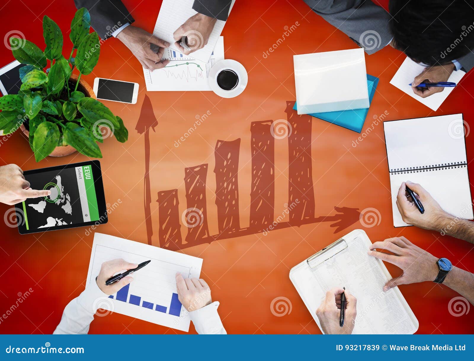 Overhead of Business Team with Red Wood Panel and Graph Doodle Stock ...