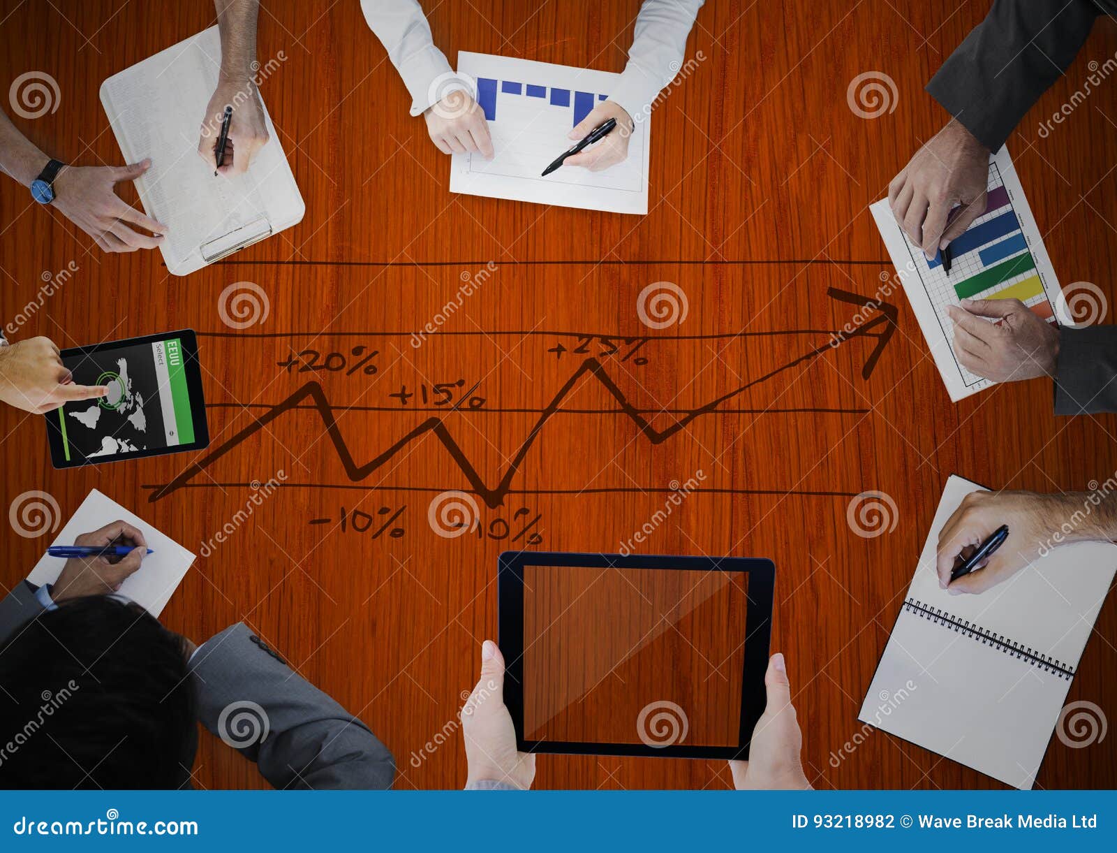 Overhead of Business Team with Wood Panel and Graph Doodle Stock Photo ...