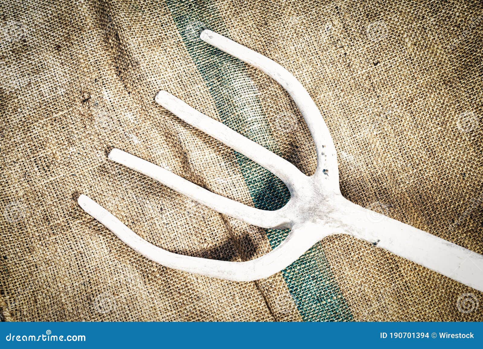 Overhead Closeup Shot of a Small White Pitchfork on a Brown Sack ...