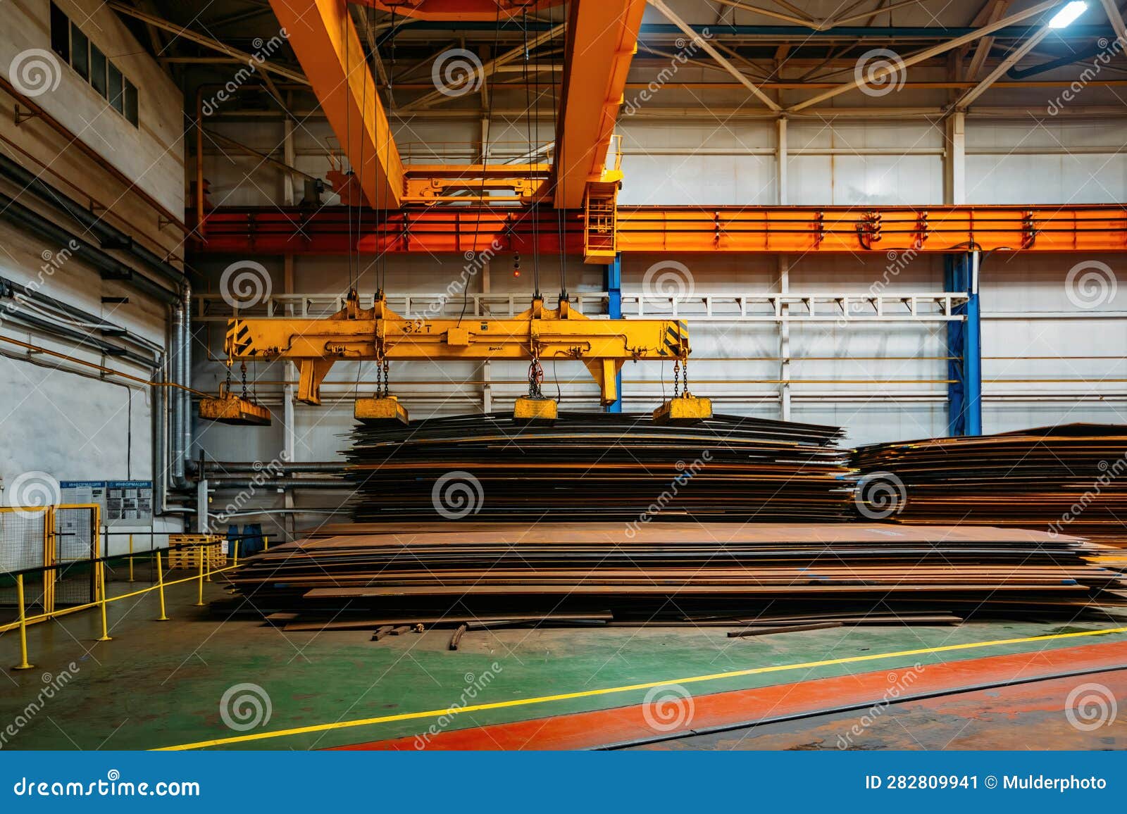 Overhead Crane with Electromagnetic Beam Grippers Loading Steel Sheets ...