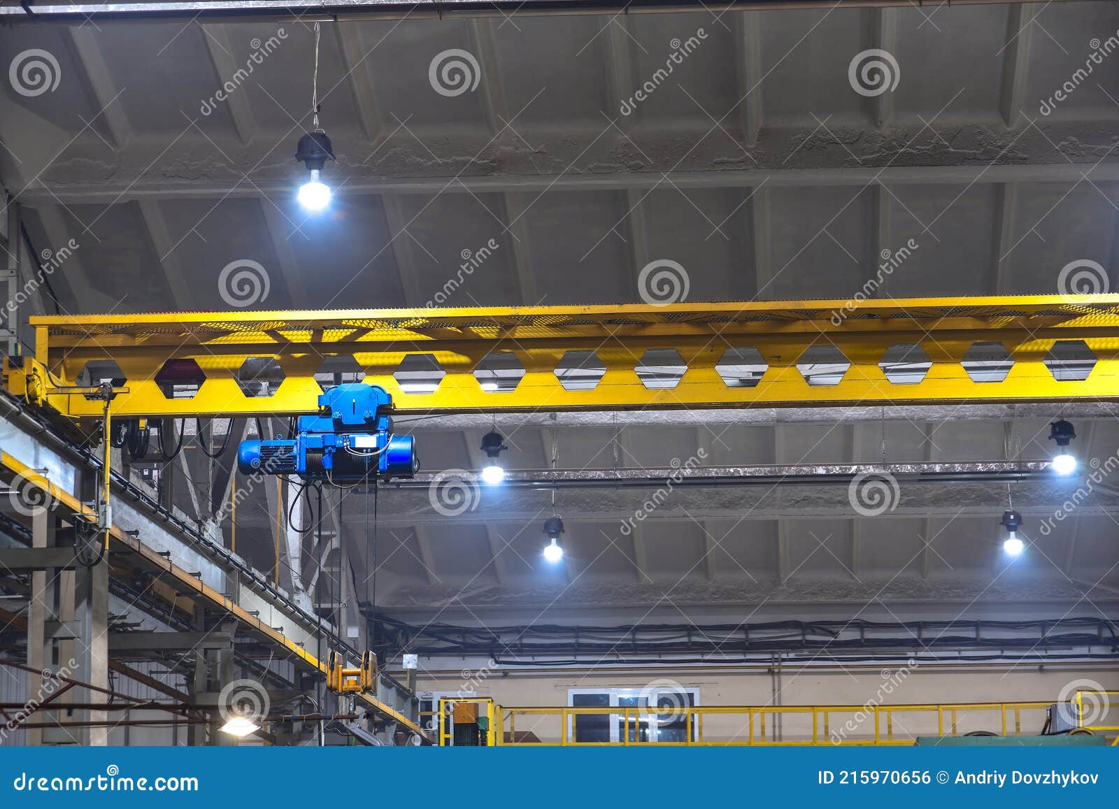 An Overhead Crane in a Workshop at a Factory, Operated by a Cran Stock ...
