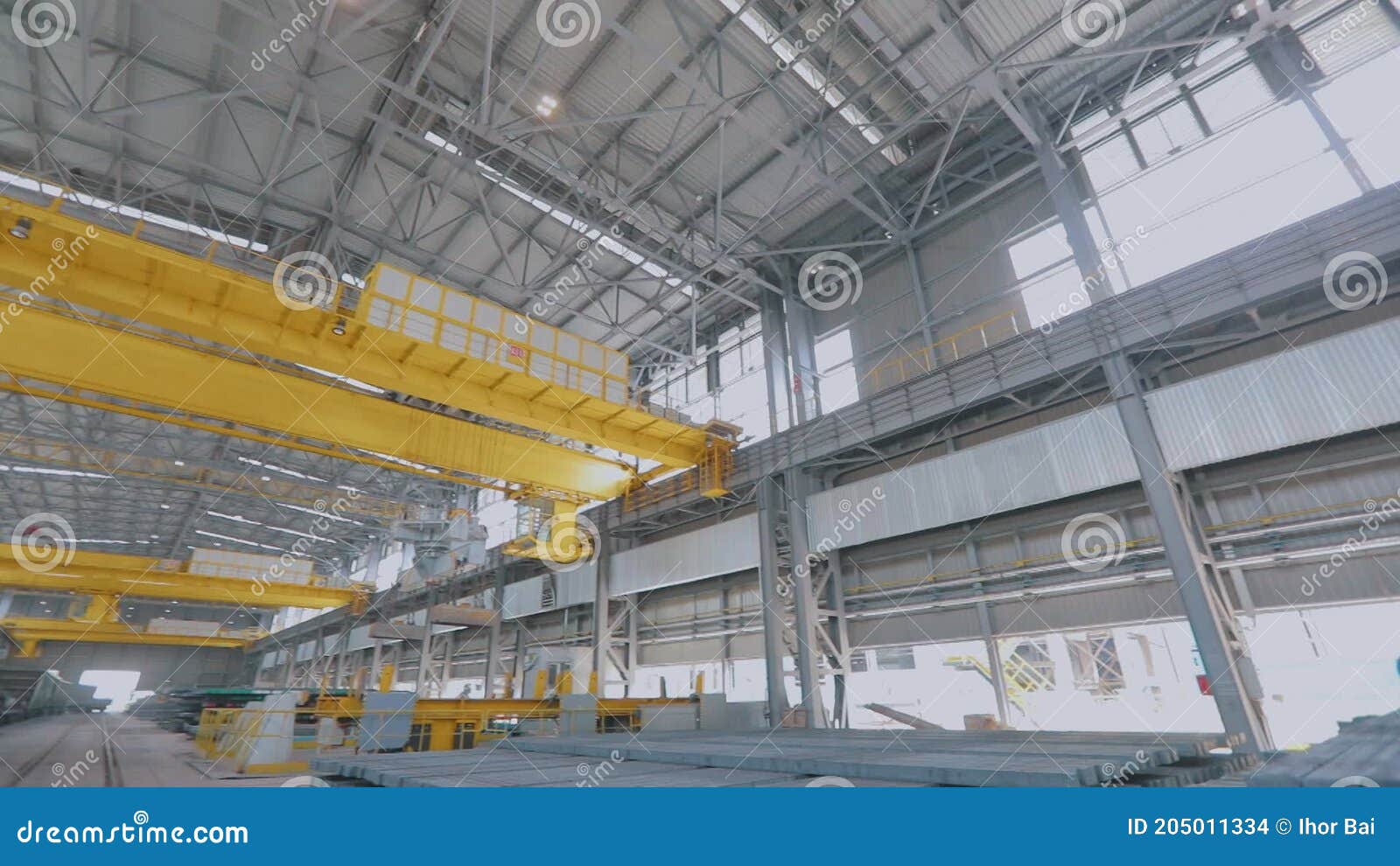 An Overhead Crane in the Workshop is Loading. a Modern Overhead Crane ...