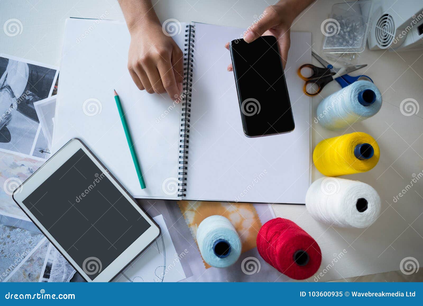 Fashion Designer Using Mobile Phone at Desk Stock Image - Image of ...