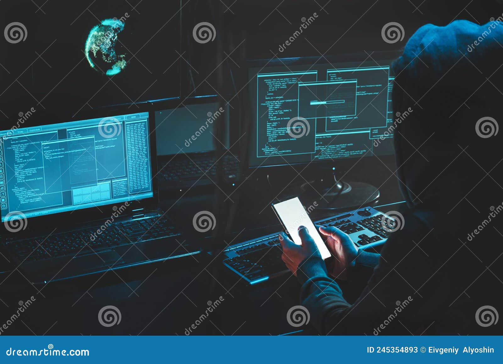 Overhead Hacker In Hood Working At Laptop And Mobile Phone Typing Text ...