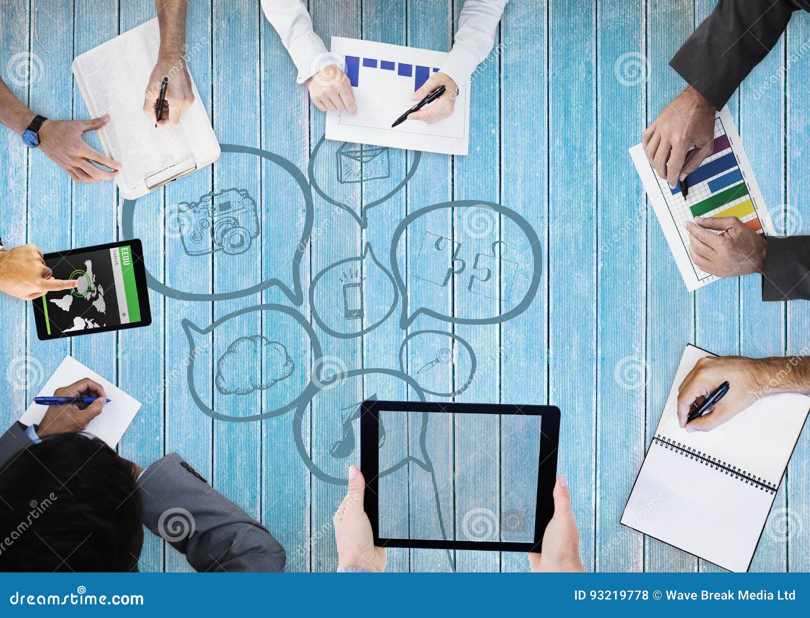 Overhead of Hands Writing with Blue Wood Panel and Speech Bubble ...