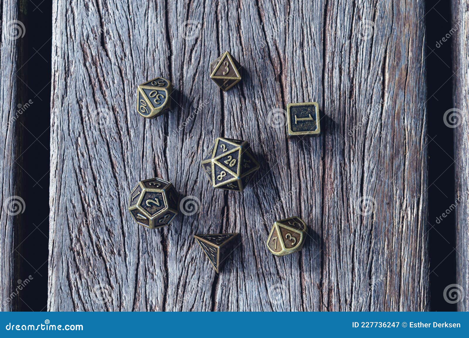 Overhead Image of a Set of Metallic Dice on a Wooden Surface Stock ...