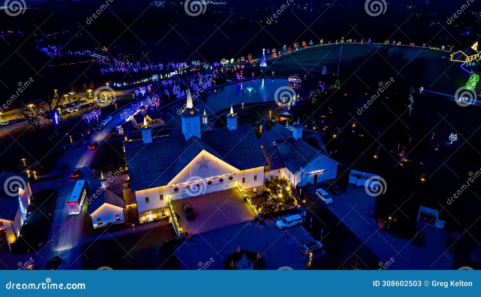 Overhead Night View of a Complex with Buildings Outlined in Lights, a ...