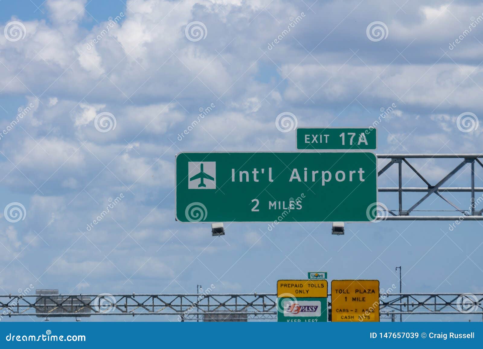 Overhead Road Direction Signs Showing Way To Orlando International