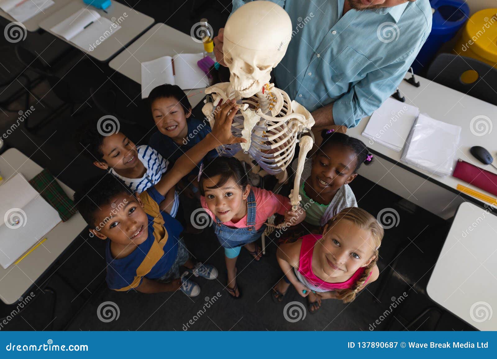 Overhead of Schoolkids Looking at Camera in Classroom Stock Image ...