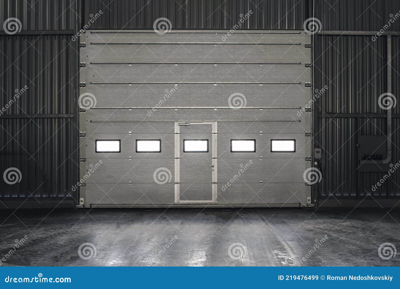 Overhead Sectional Gate Inside an Industrial Building Stock Image ...