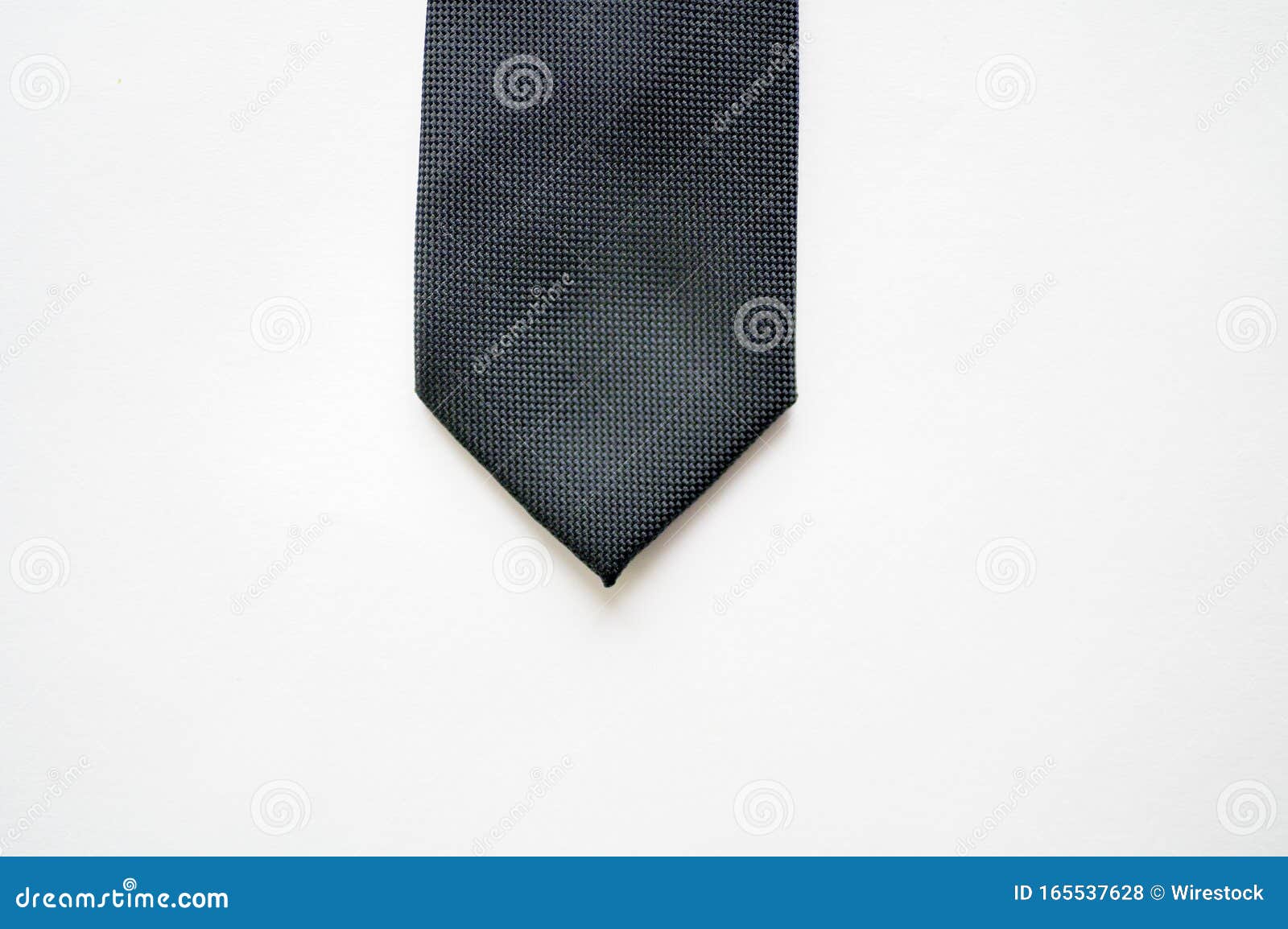 Overhead Shot of a Black Tie on a White Surface Stock Photo - Image of ...