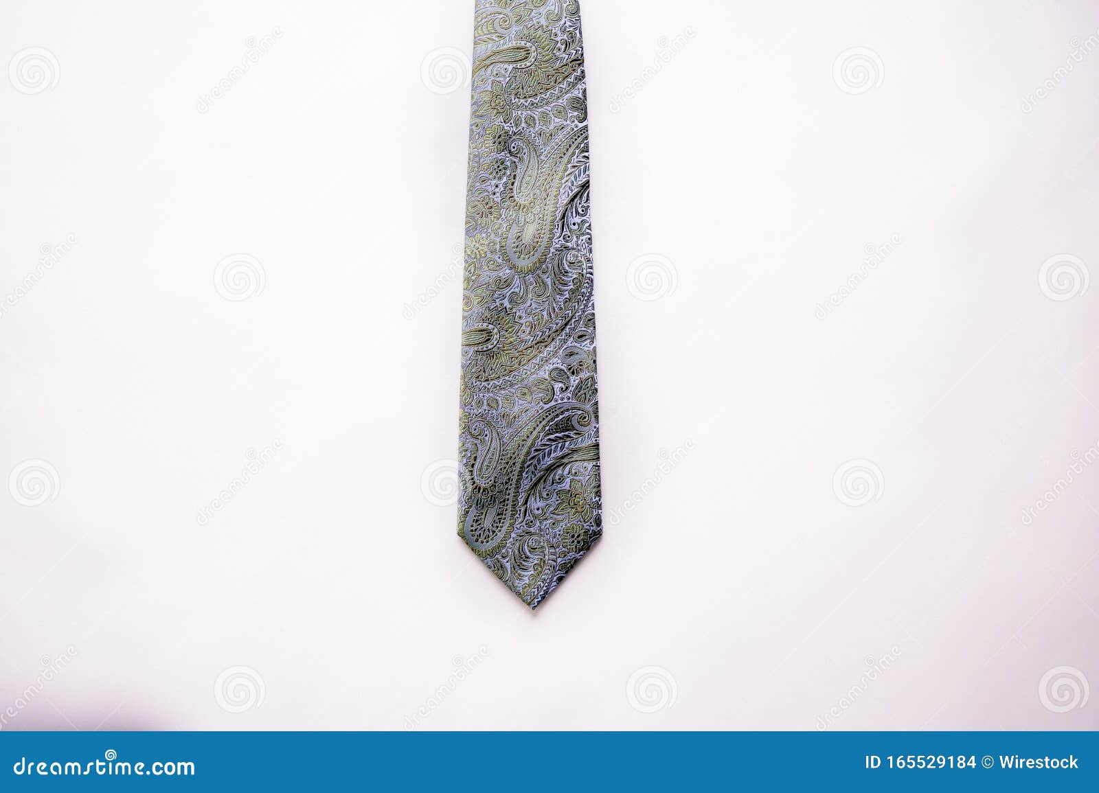 Overhead Shot of a Blue Tie with Patterns on a White Surface Stock ...