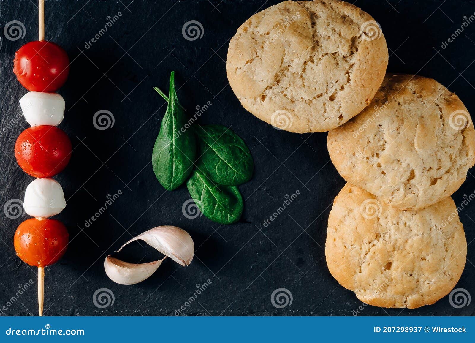 Overhead Shot of Bread, Garlic, Herbs, and Mozzarella-tomato Sticks on ...