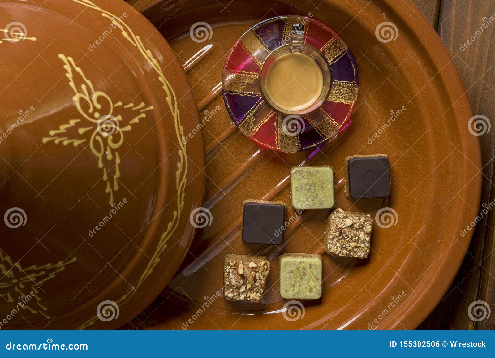 Overhead Shot of Different Types of Square-shaped Sweets with Tea on a ...