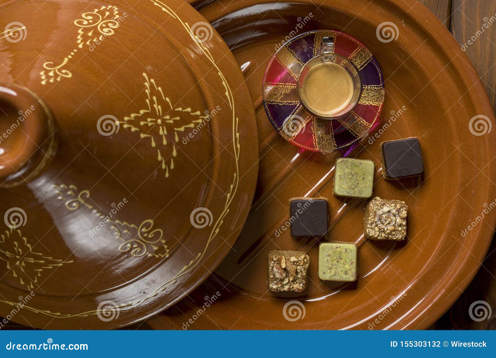 Overhead Shot of Different Types of Square-shaped Sweets with Tea on a ...