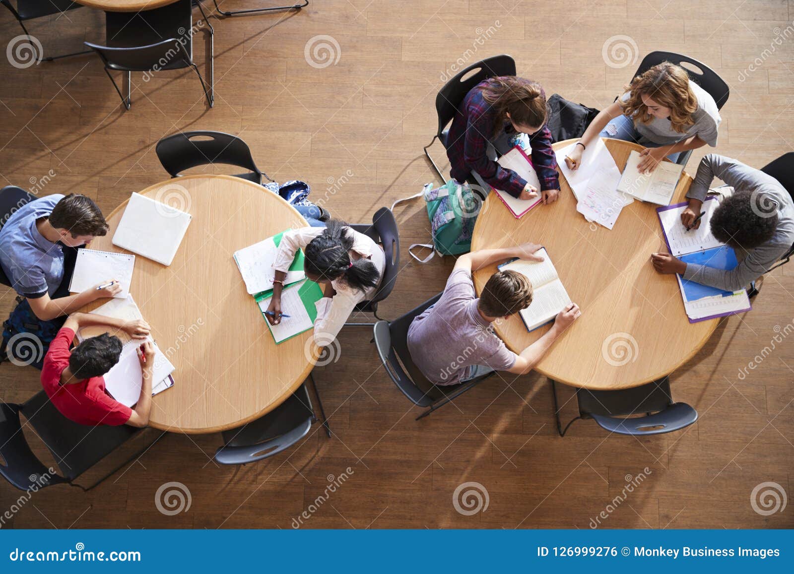 Overhead Shot of High School Pupils in Group Study Around Tables Stock ...