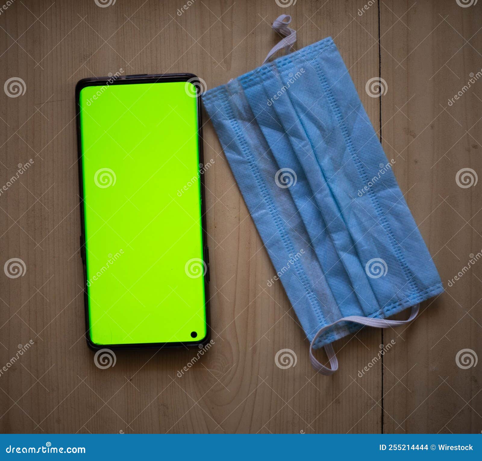 Overhead Shot of a Mask and a Phone Screen Stock Photo - Image of mask ...